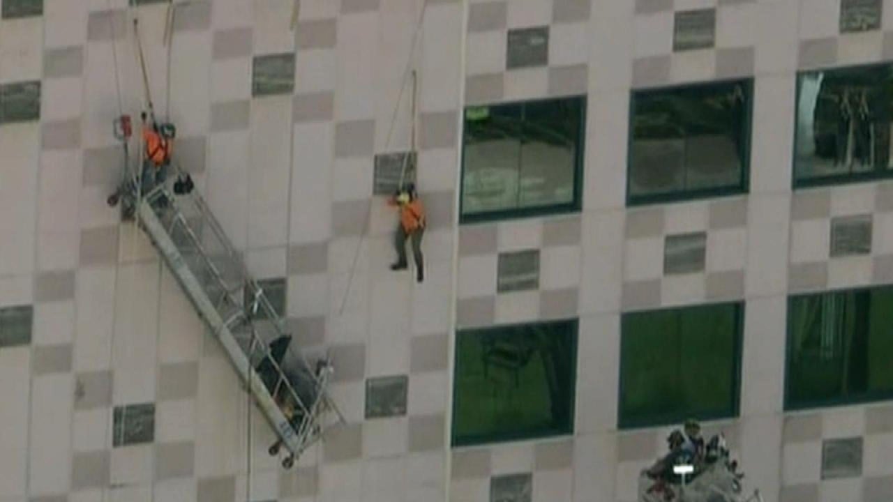 Workmen Rescued After Dangling Off Side of High-Rise | Inside Edition